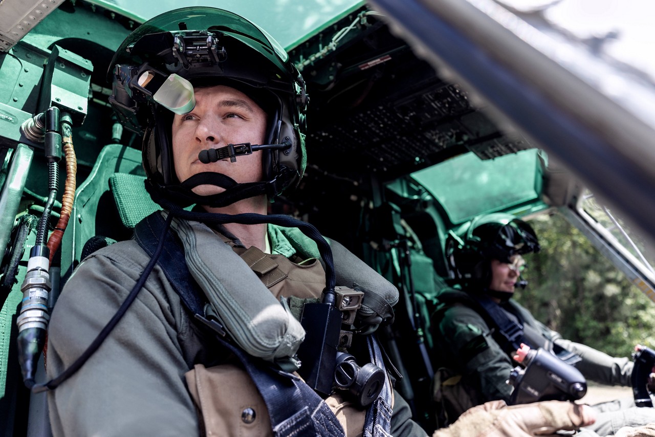 Marines sitting in front of the Marine Corps war memorial.